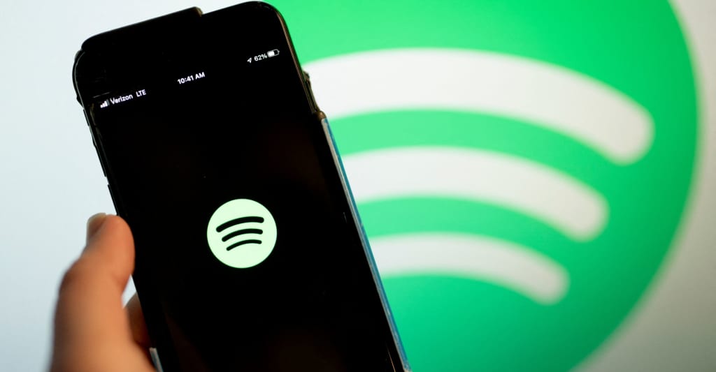Spotify launches takedown of AI-generated songs with fake streams | The ...